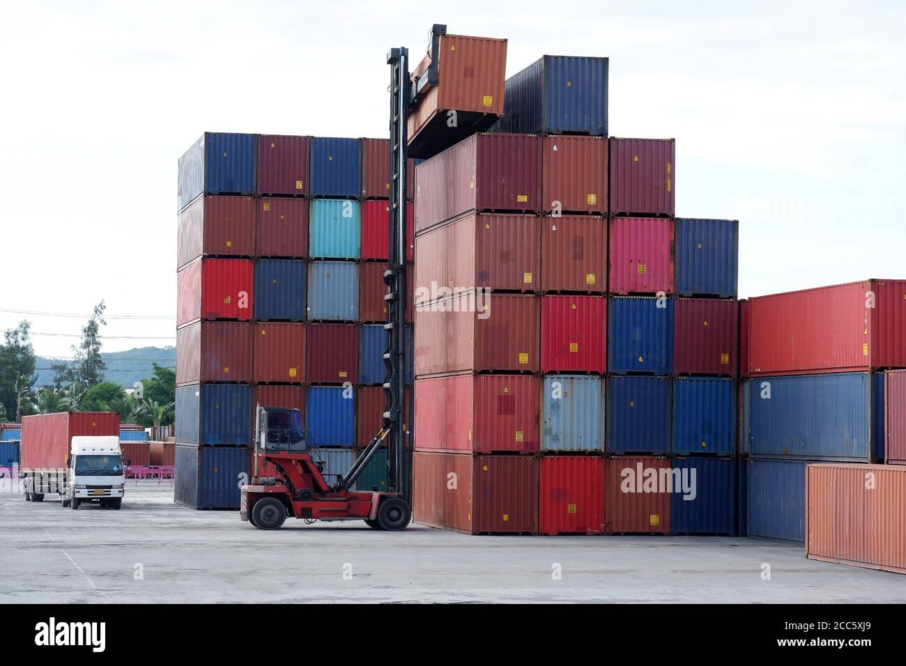 Container handling vehicle container ship storage Stock Photo - Alamy