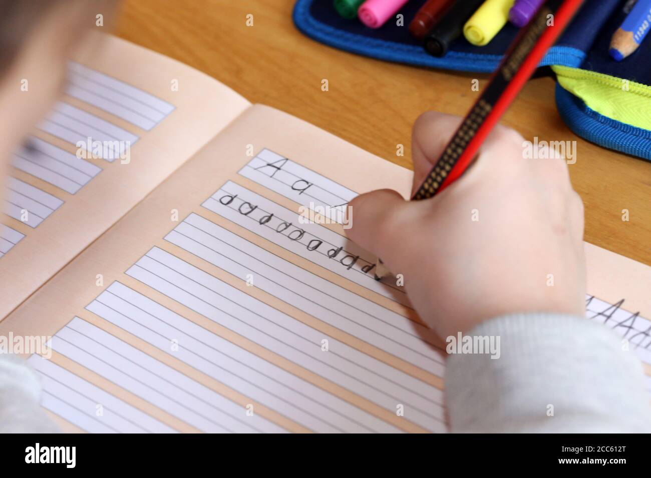 Symbol image: First grader learns writing Stock Photo - Alamy