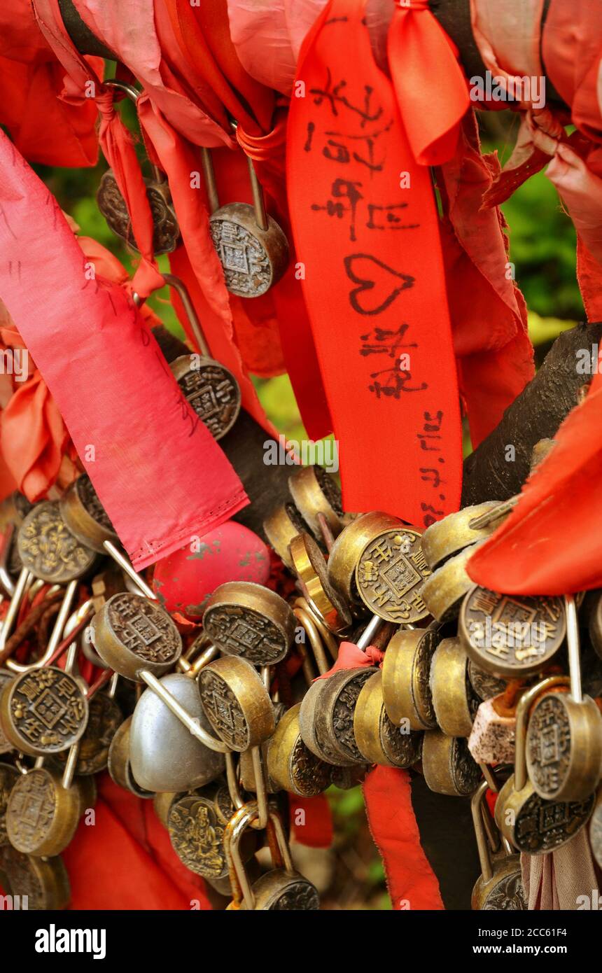 Zhangjiajie, China - May 10, 2017: Detail of love locks with red ...