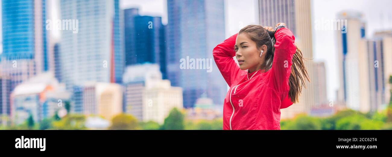 City running healthy lifestyle banner runner woman tying ponytail hair ...