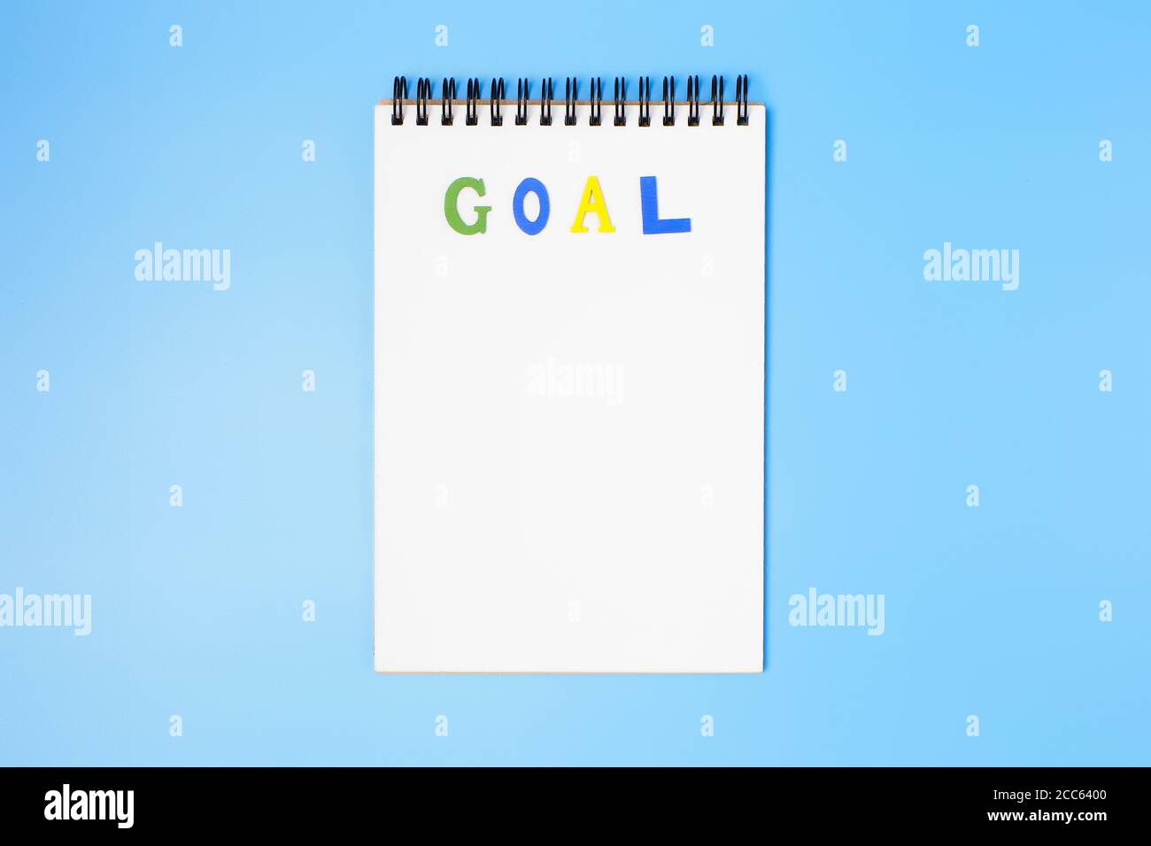 Goal,plan,action text on notepad with office accessories.Business ...