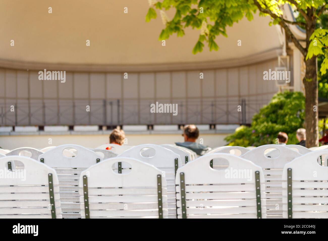 Outdoor concert hall with individual people Stock Photo - Alamy