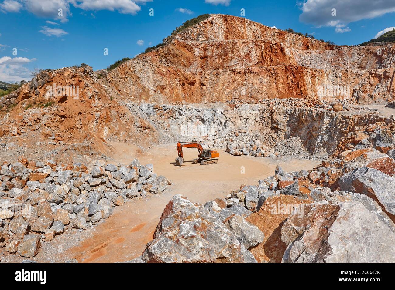 Heavy excavator on a quarry. Excavation machinery. Earthmover Stock ...