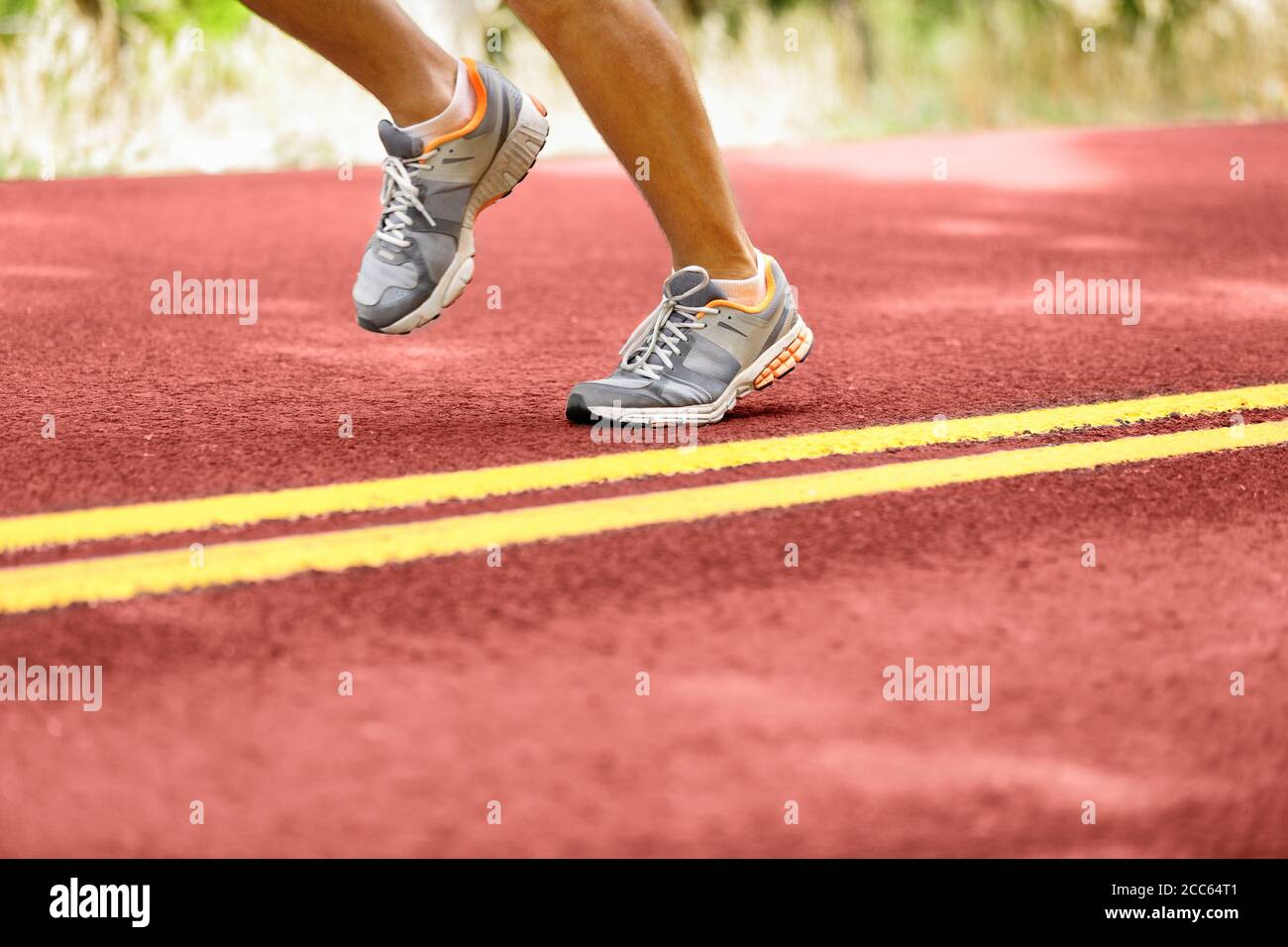 Man Running By Double Yellow Lines On Road Stock Photo - Alamy
