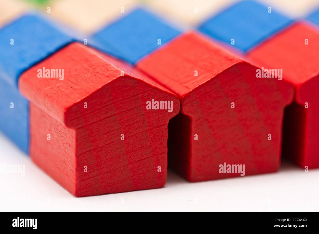 Rows of tiny wooden toy houses painted in different colors Stock Photo ...