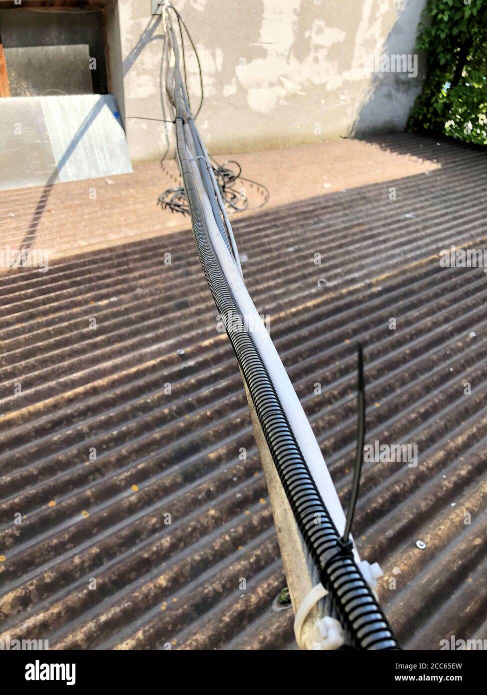 Electric cables hanging there Stock Photo - Alamy