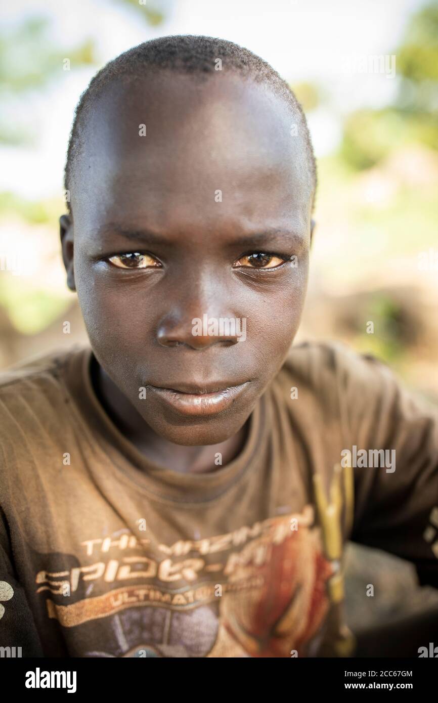 Sad african refugee boy close up hi-res stock photography and images ...
