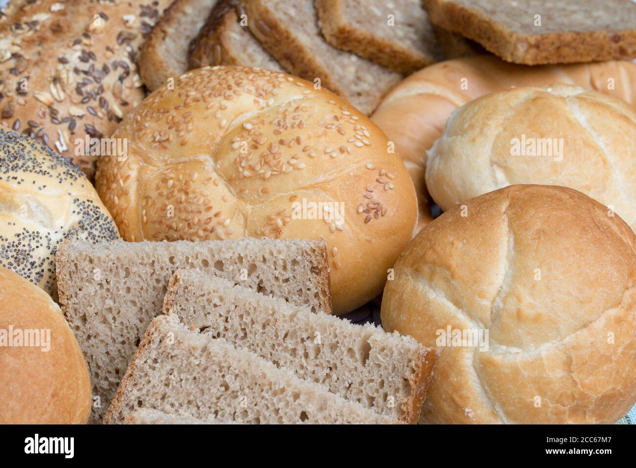 variety of fresh breads and buns closeup selective focus Stock Photo ...