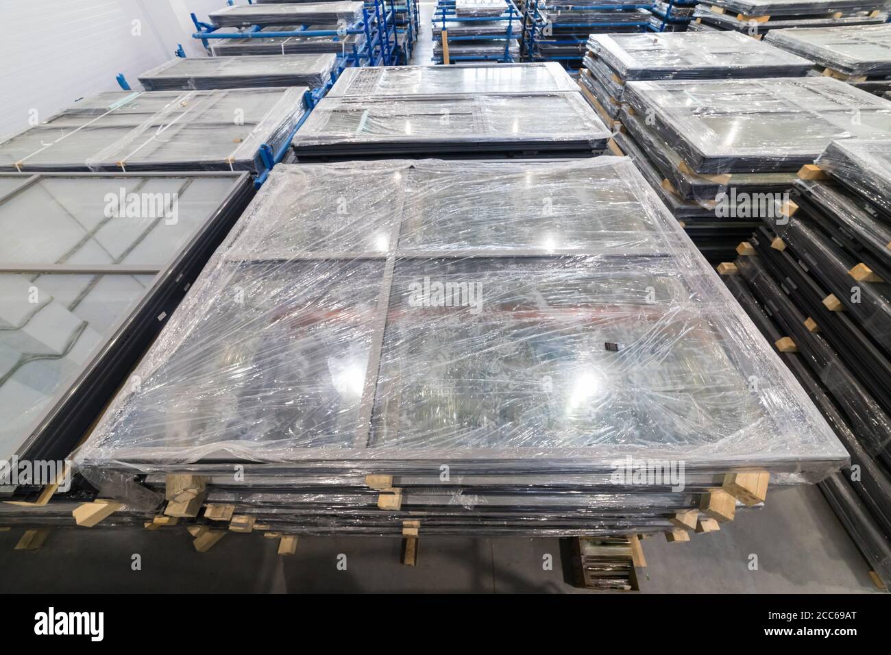 Shipping the plastic windows packed in plastic sheets. Mid shot Stock ...