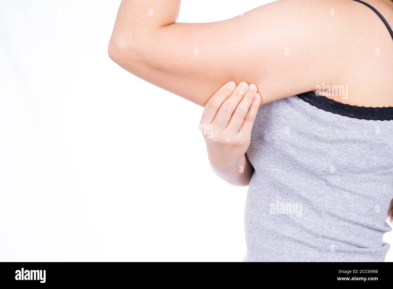 Woman holding excessive fat arm isolated on over white background ...