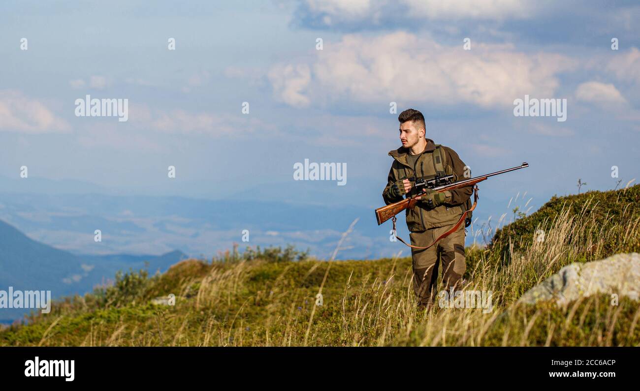 Hunter man. Shooter sighting in the target. Hunting period. Hunter is ...