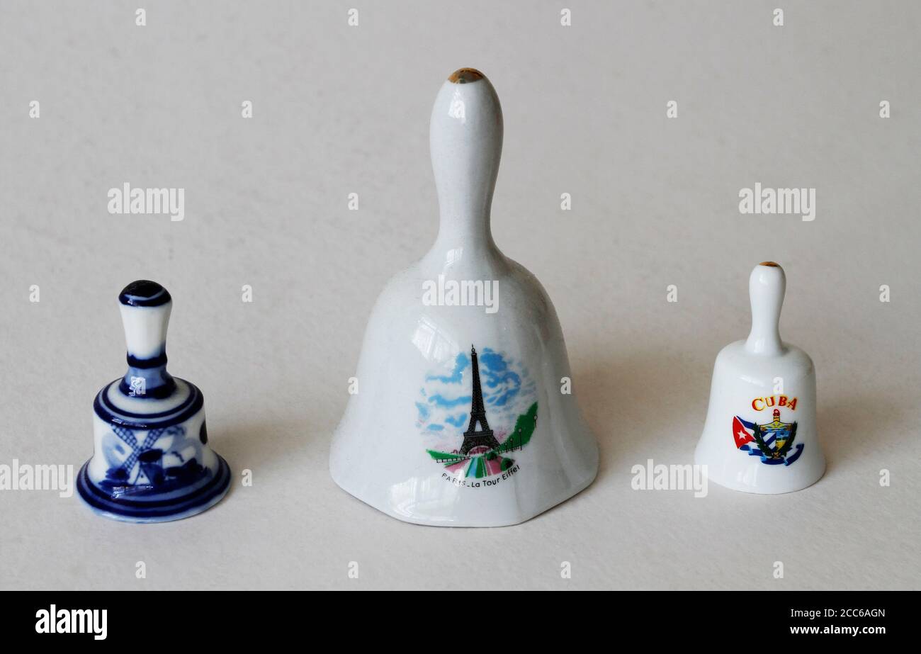 Ceramic, hand bell decorated with patterns on white. Hand bell in ...