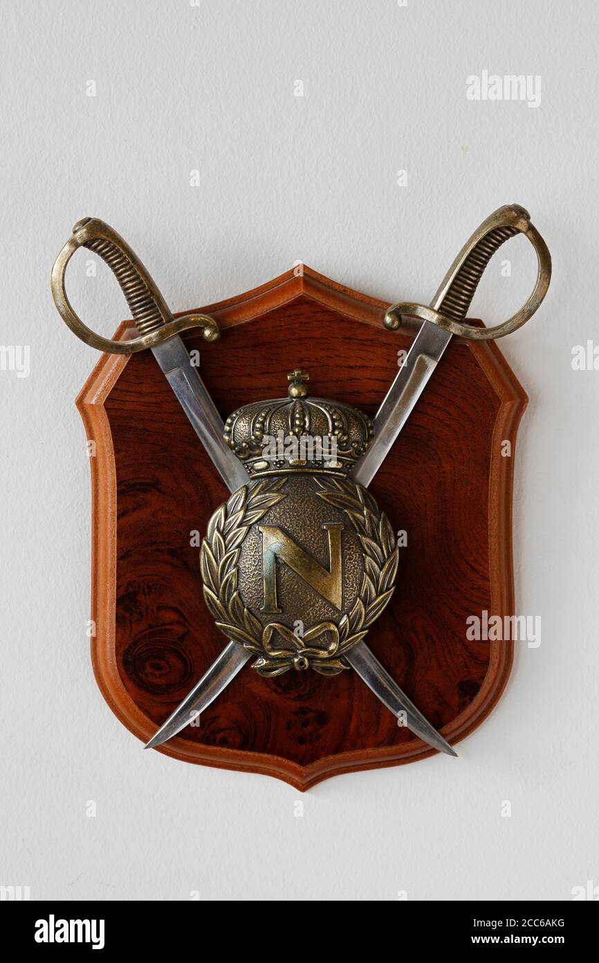 Souvenirs made of wood, consisting of the symbol of Napoleon, swords ...