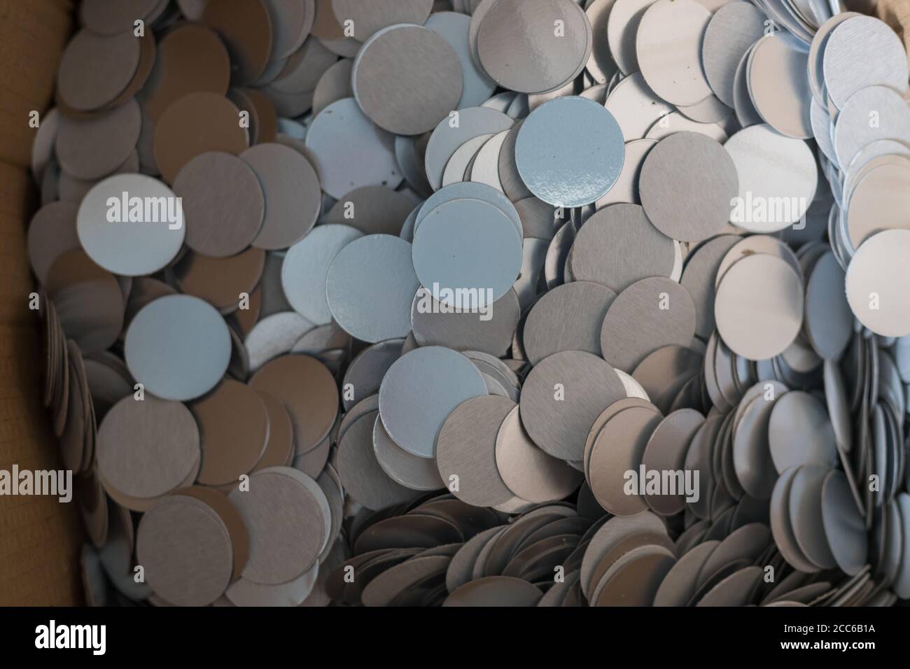 Round cardboard residues in cardboard production. Mid shot Stock Photo ...