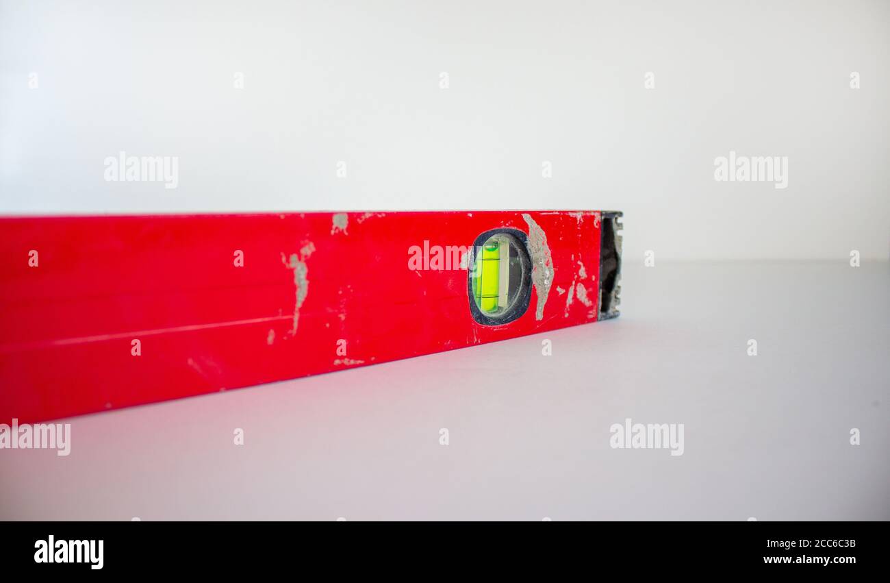 Building tool level. Red water level tool isolated on white background ...