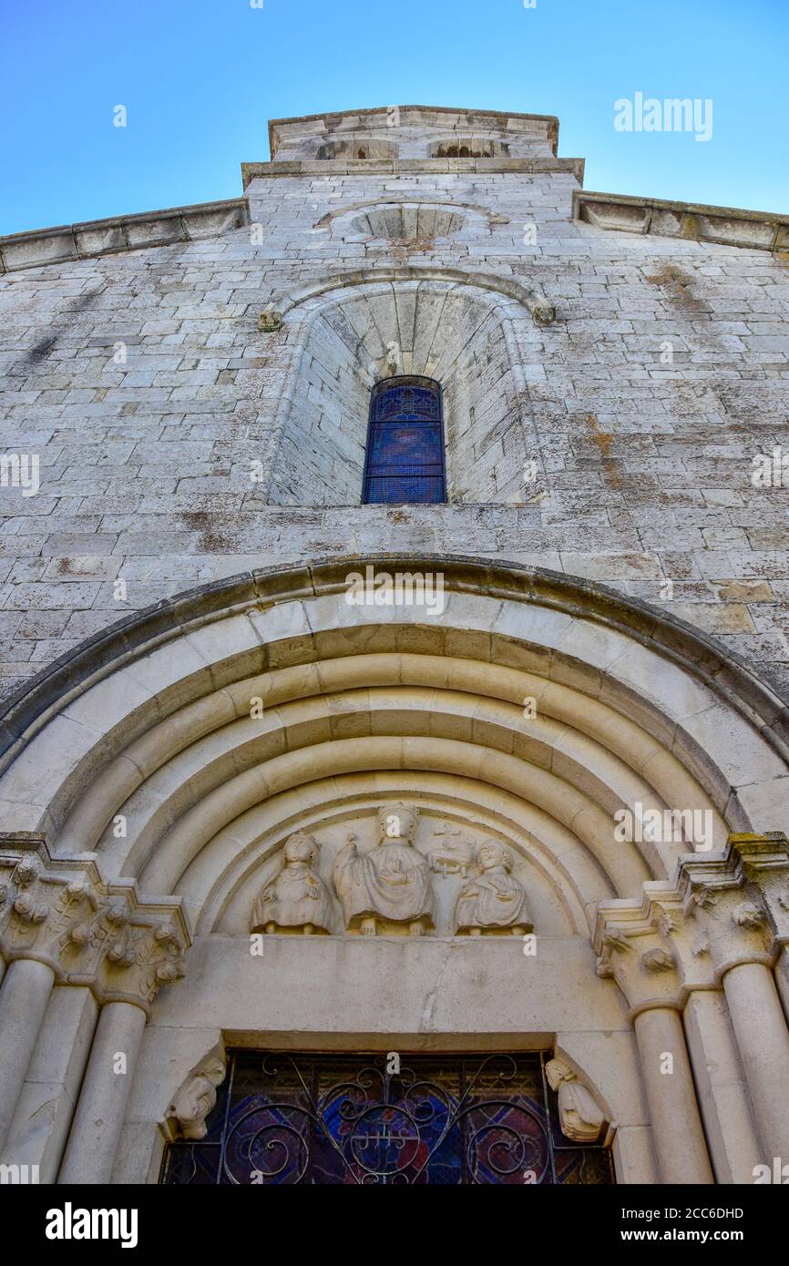 Medieval portal of Saint Geraud Church, sculpture of crowned Jesus ...