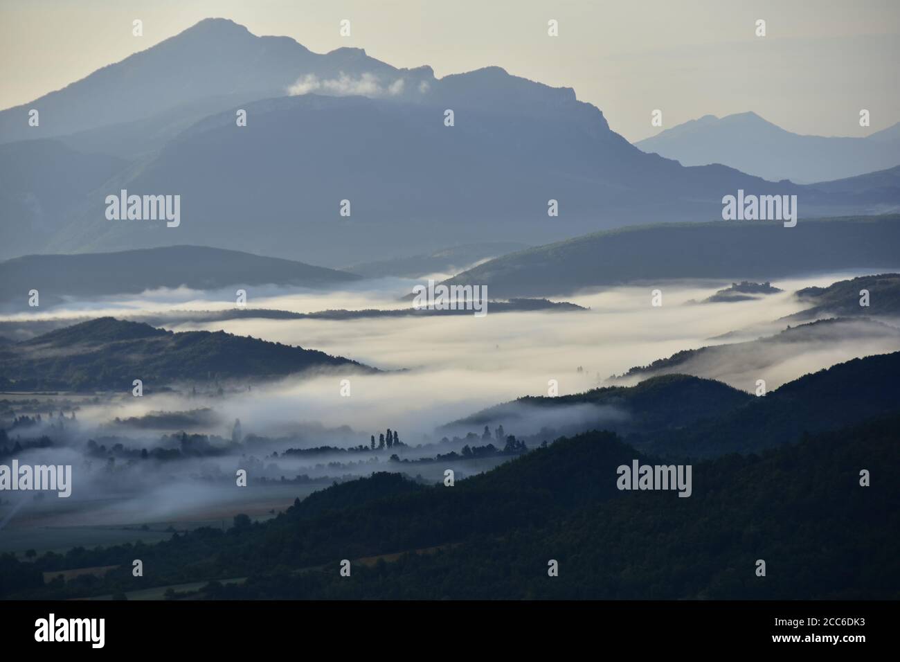 Morning mist in the valley at sunrise, La Beaume, Hautes Alpes, France ...