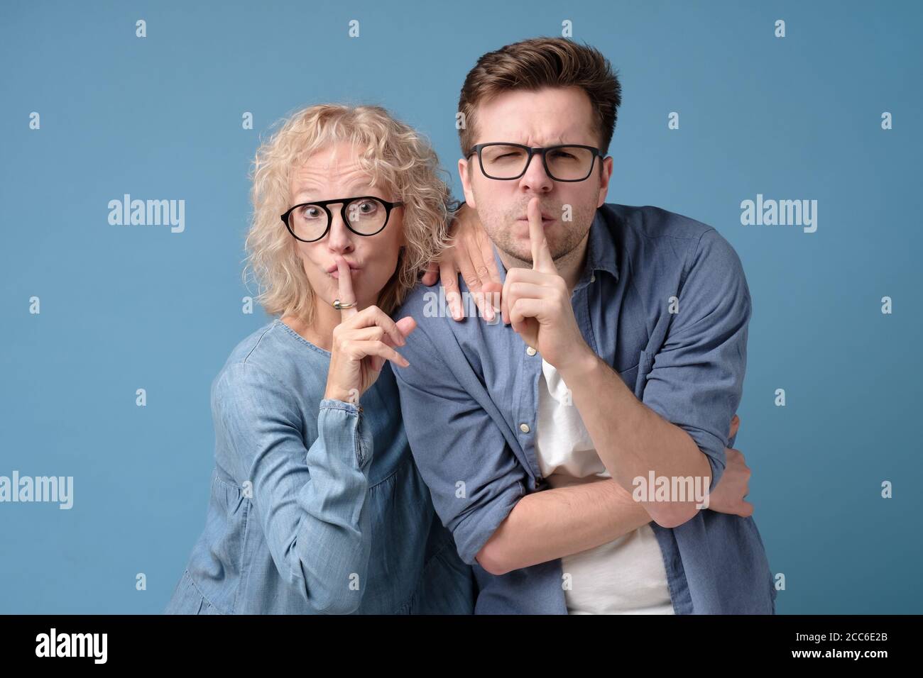 Two fingers on lips hi-res stock photography and images - Alamy