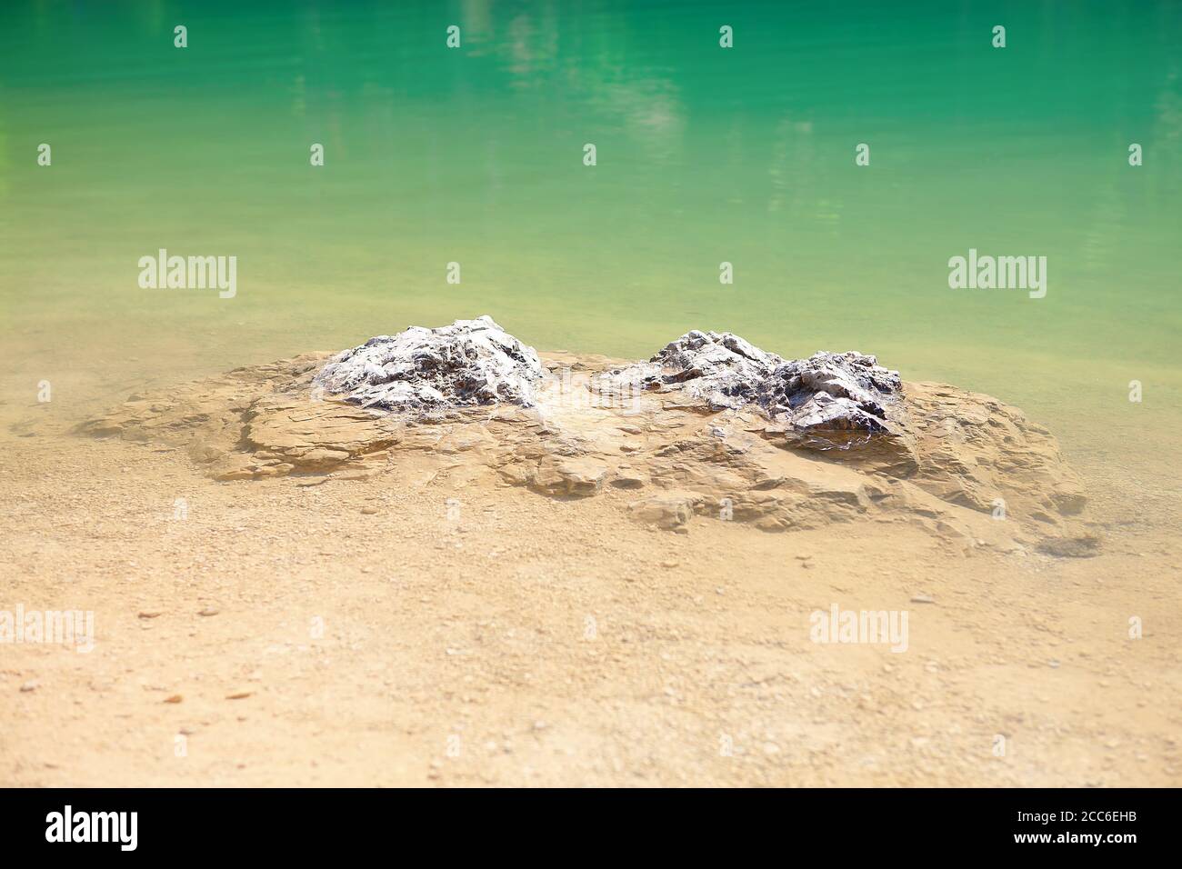 clay rock in transparent lake water Stock Photo - Alamy