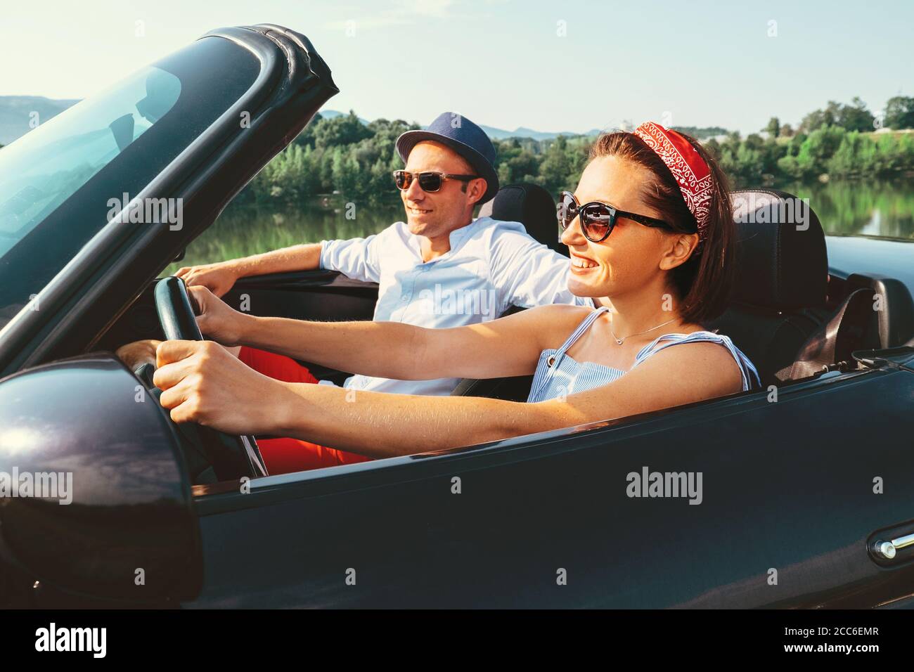 Couple in love ride in cabriolet car Stock Photo - Alamy