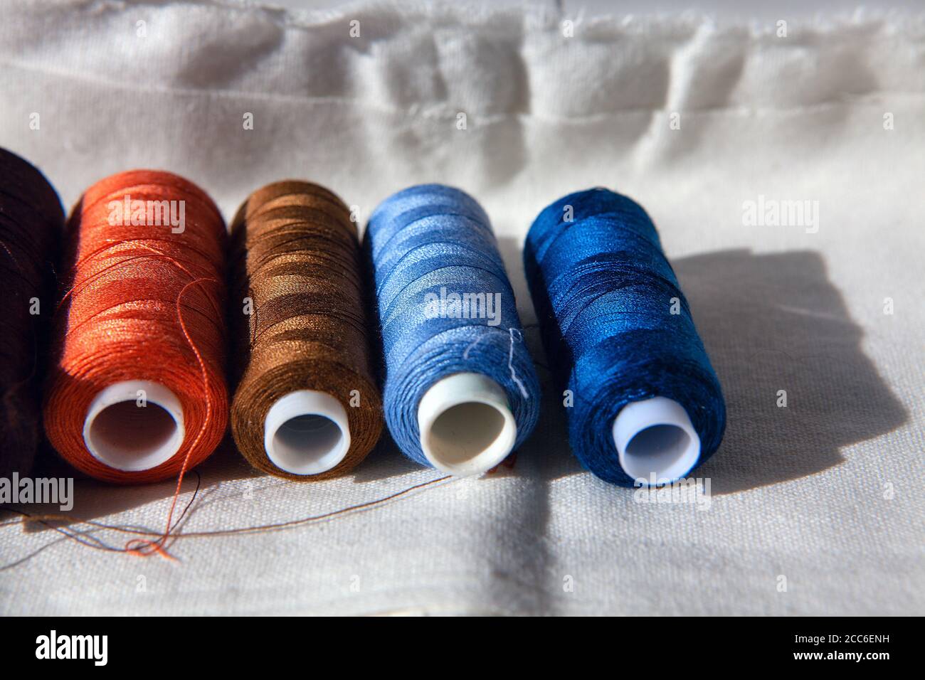 Spools with colorful sewing thread Stock Photo - Alamy