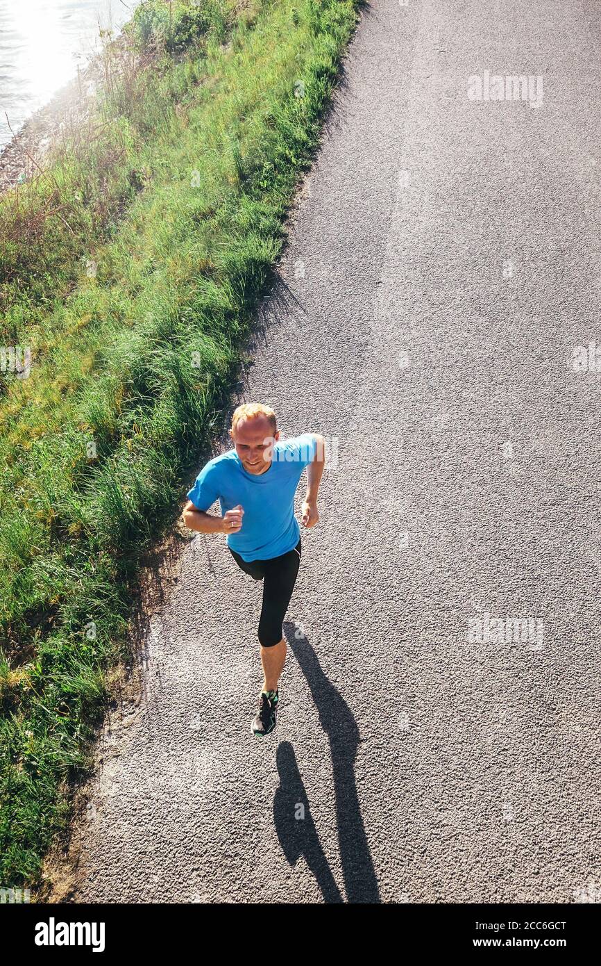 Jogging man top view portrait Stock Photo - Alamy