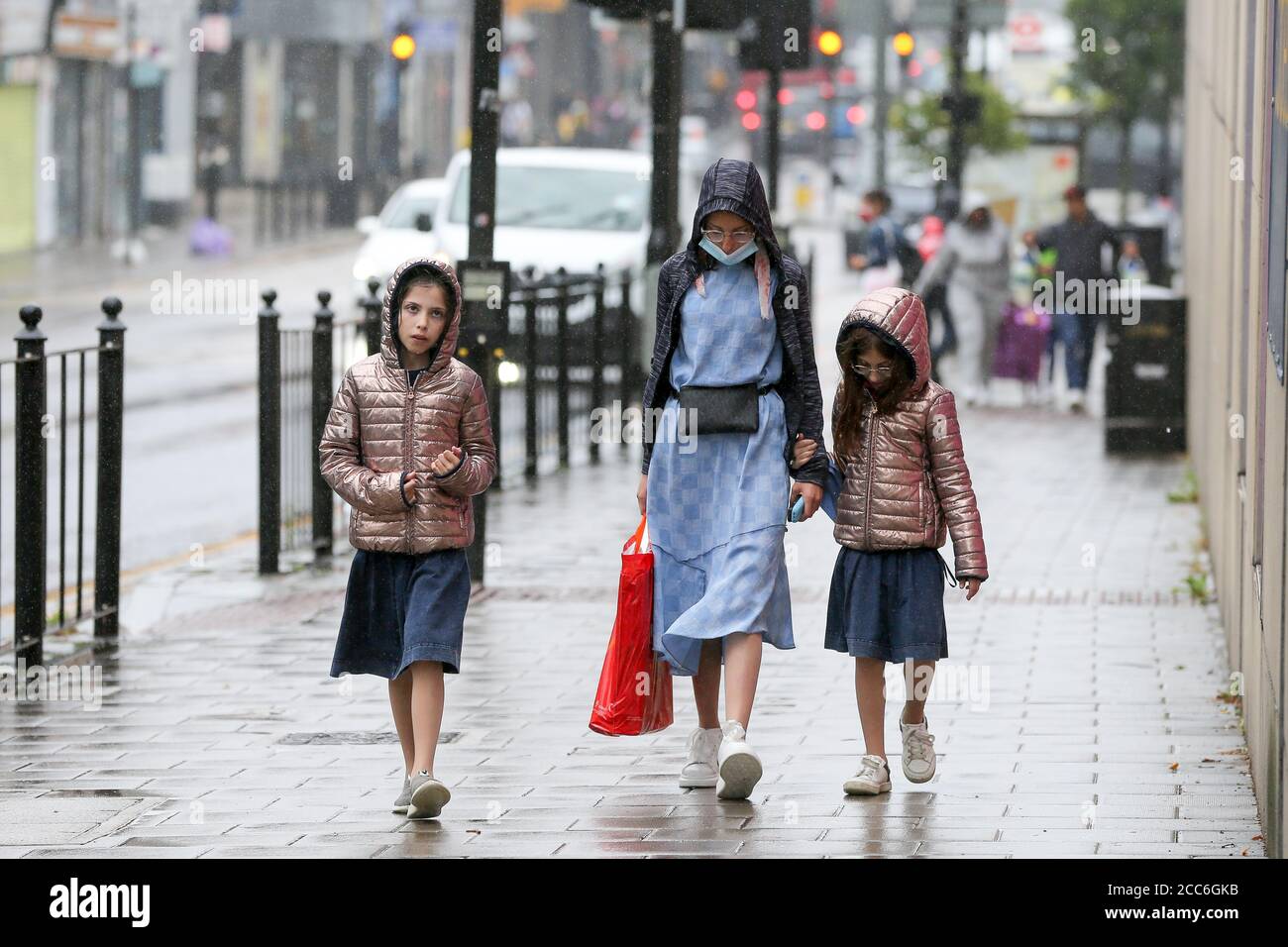 Children caught in the rain hi-res stock photography and images - Alamy