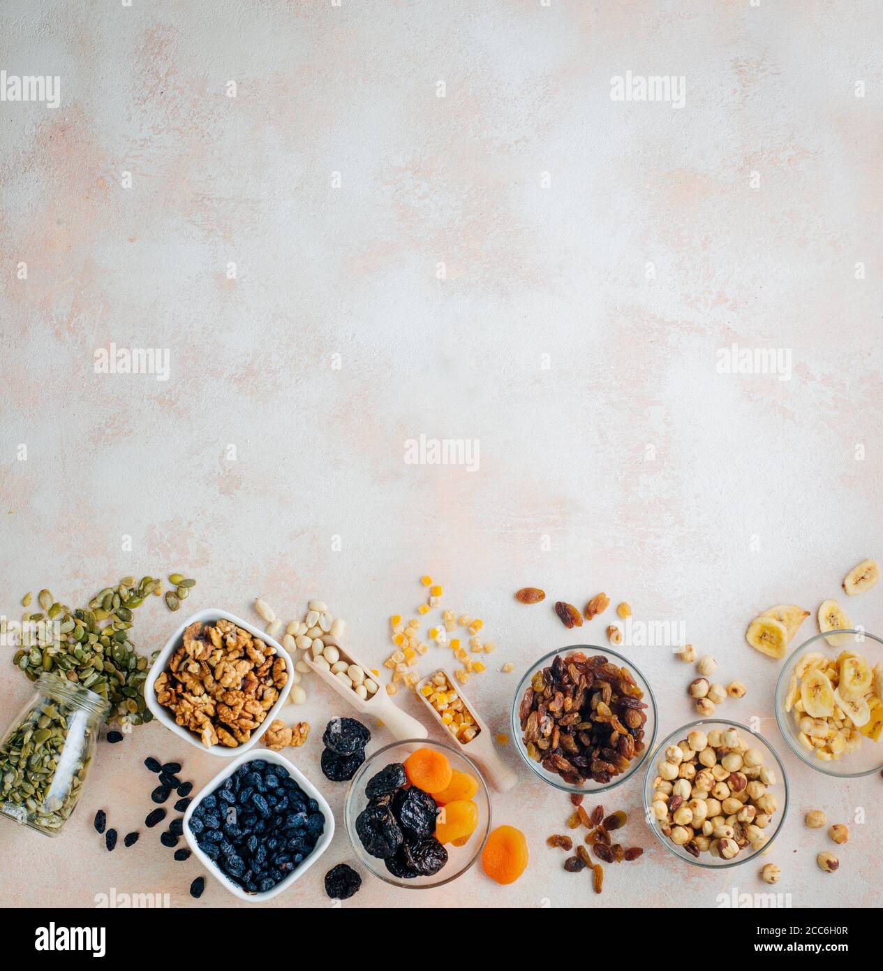 Dried fruits, nuts and seeds on beige background with copy space Stock ...