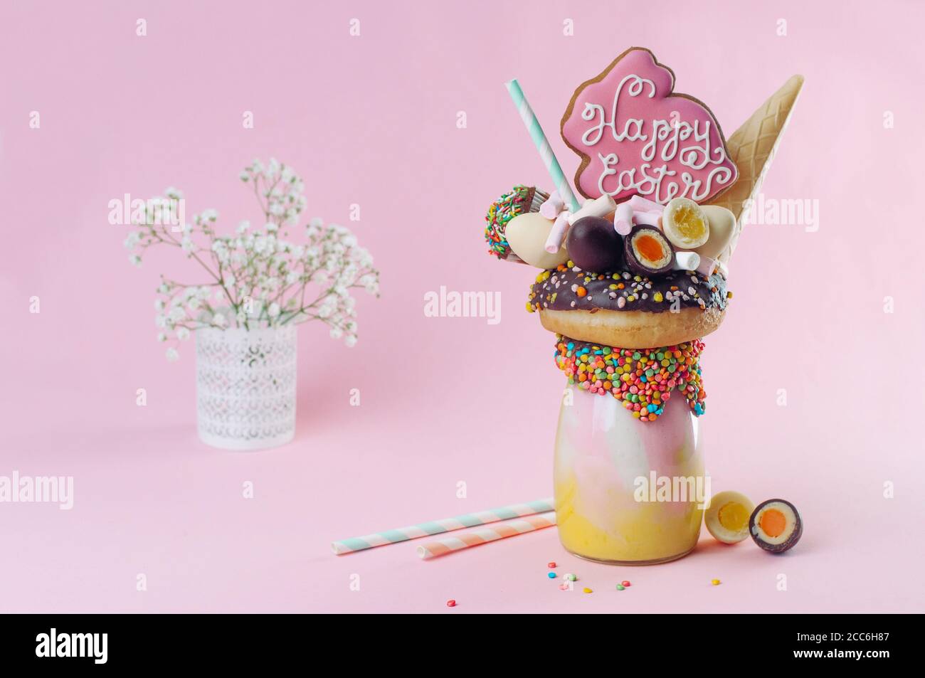 Glass pink milkshake decorated candy hi-res stock photography and ...
