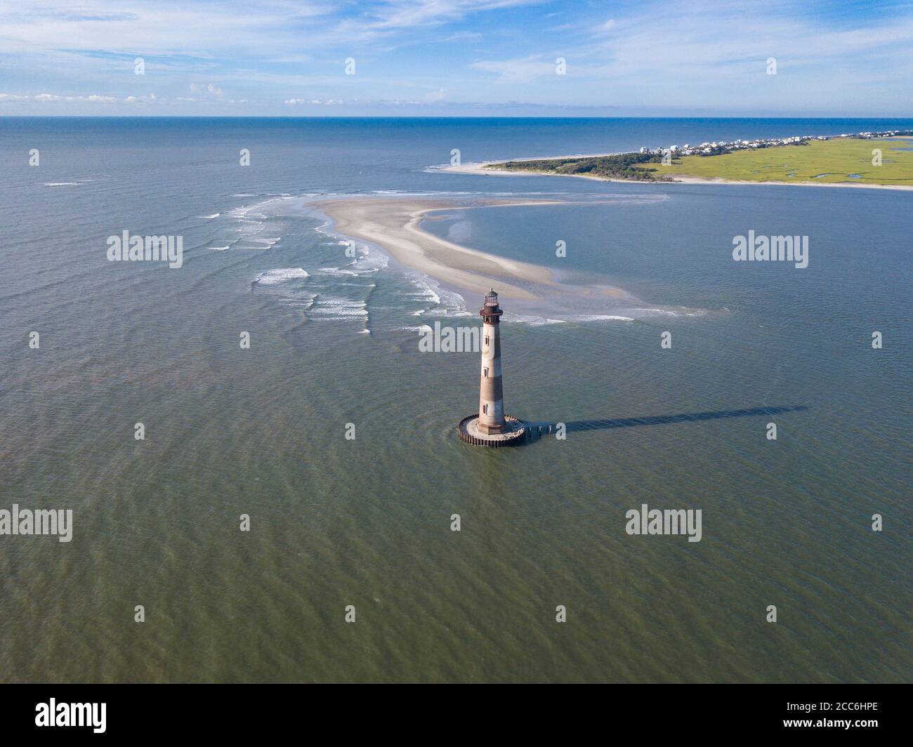 High aerial view of the Morris Island Lighthouse with Folly Beach in ...