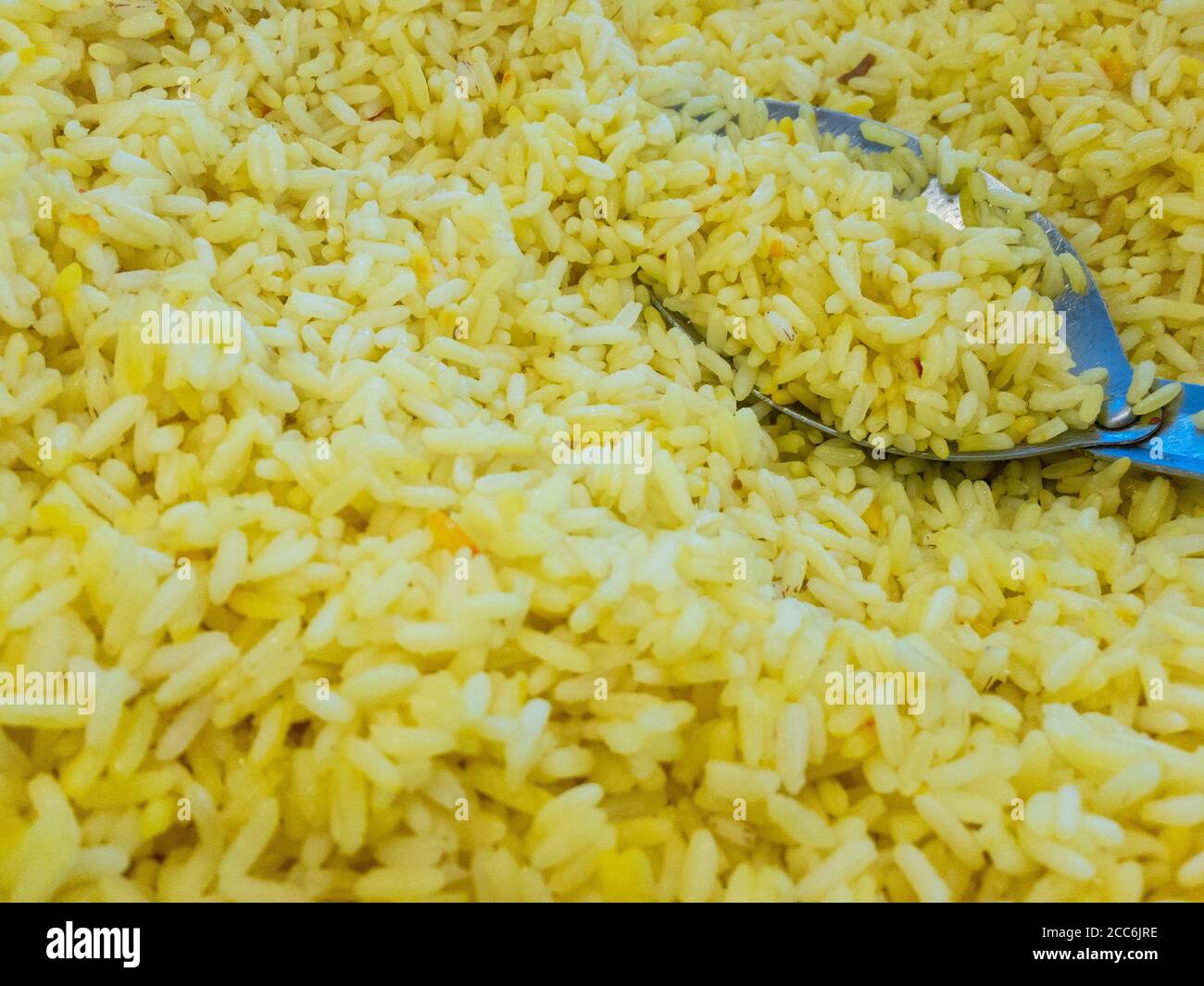 Rice yellow spoon hi-res stock photography and images - Alamy