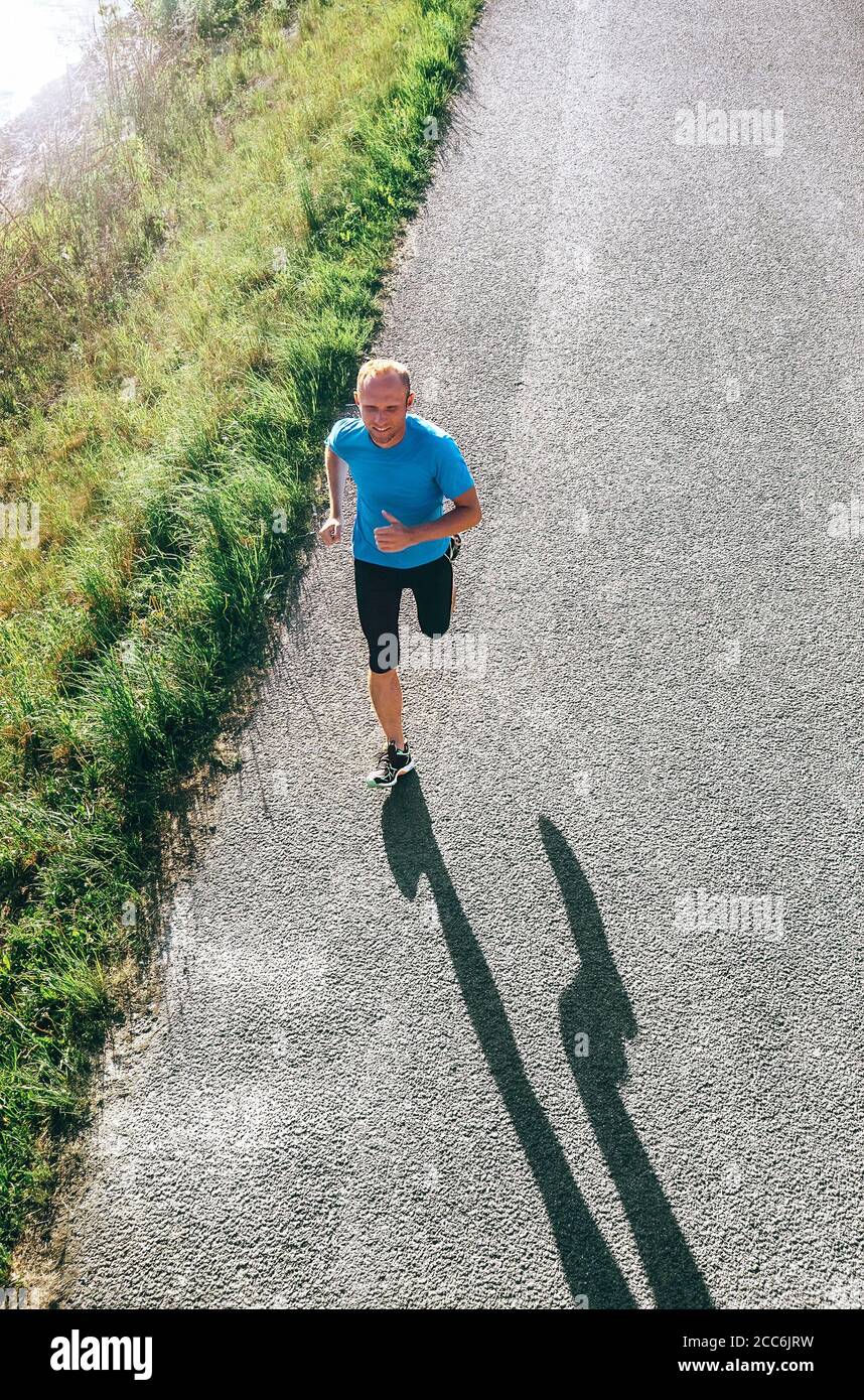 Jogging man top view portrait Stock Photo - Alamy