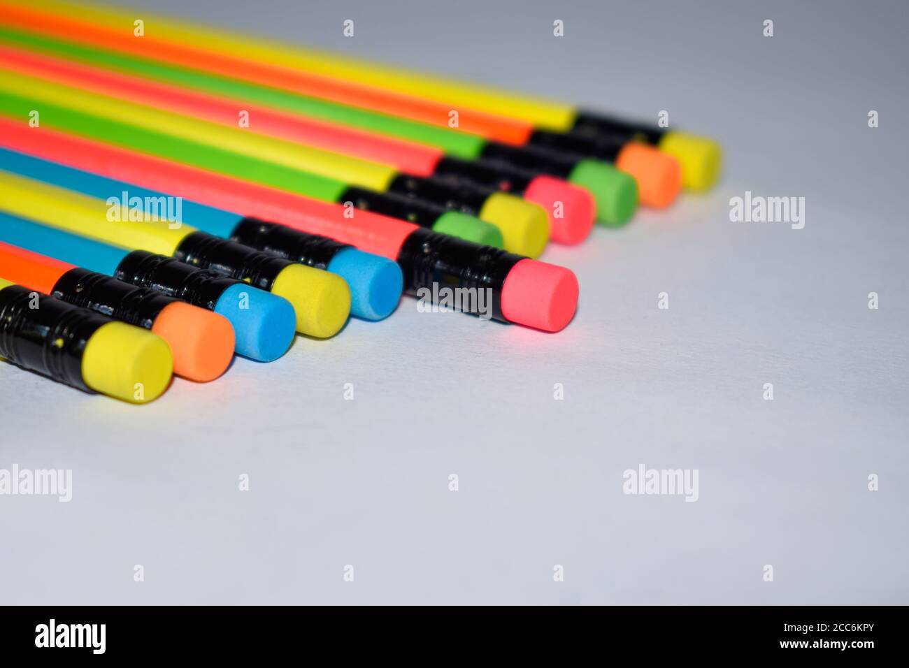 Strait line of different colored wood pencil crayons placed on an ...