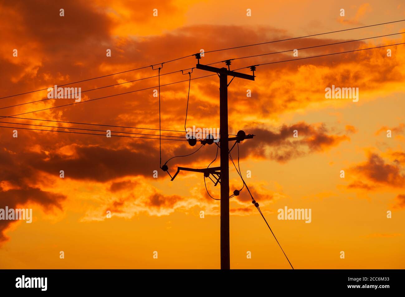 Wooden electricity distribution pole and cables at sunset. UK Stock ...