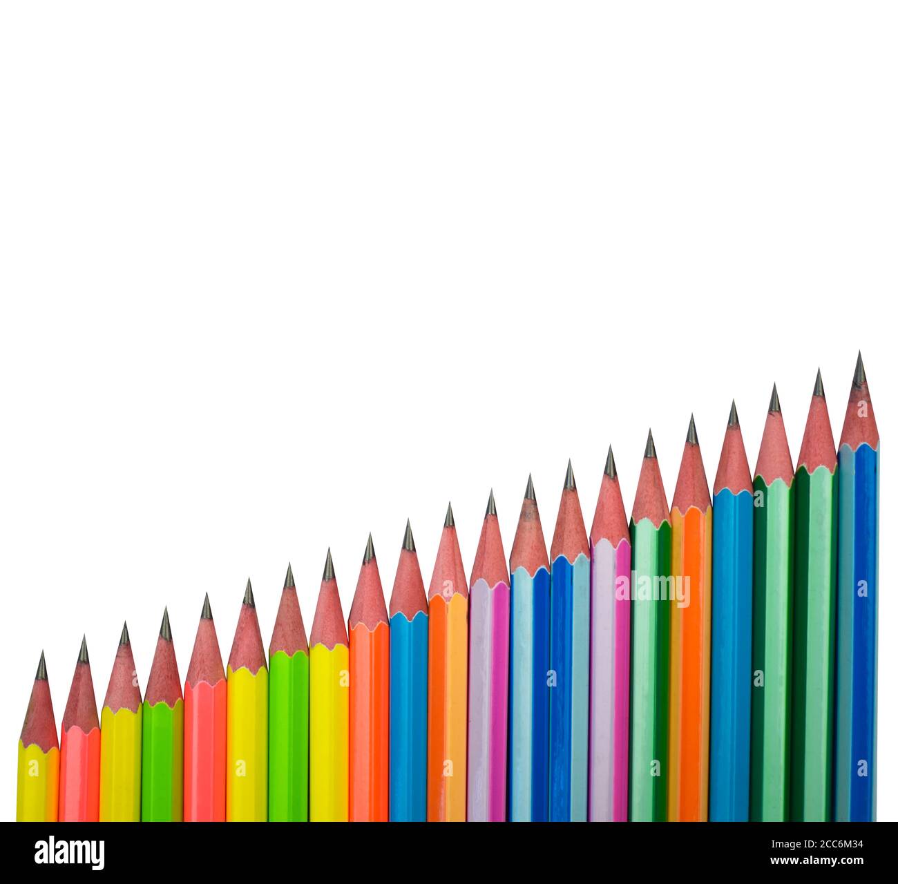 A line of different colored wood pencil crayons placed on an isolated ...