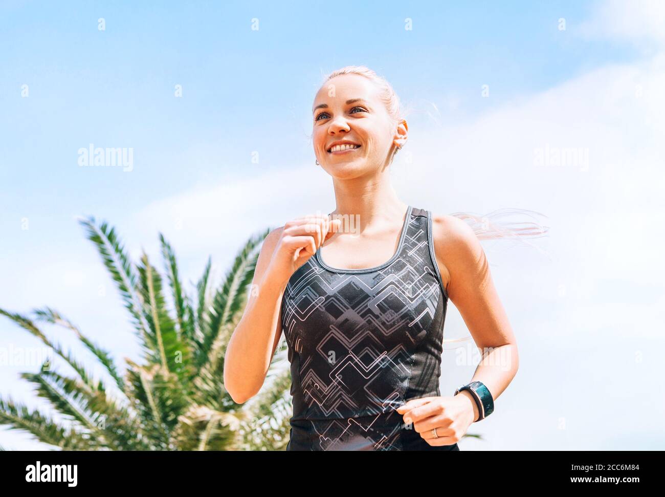 Happy smiling running girl portrait Stock Photo - Alamy