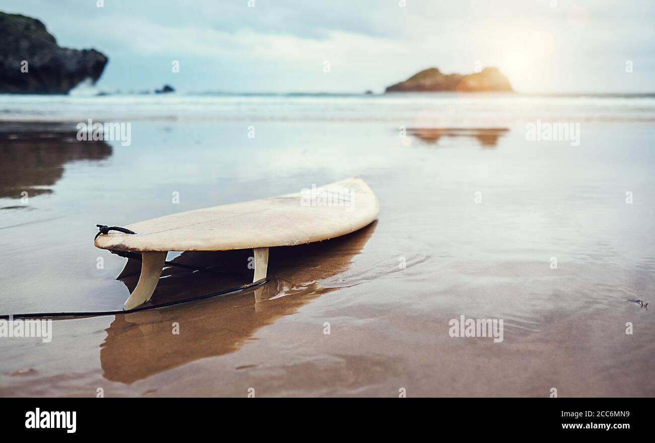Surfer lying on surf board hi-res stock photography and images - Alamy