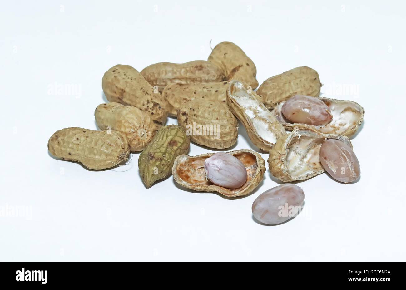 Organic peanuts in shell isolated on white background. Heap of peanut ...