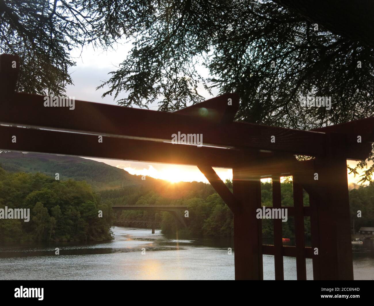 Scottish scenery: a sunset over Loch Faskally with the A9 road bridge ...