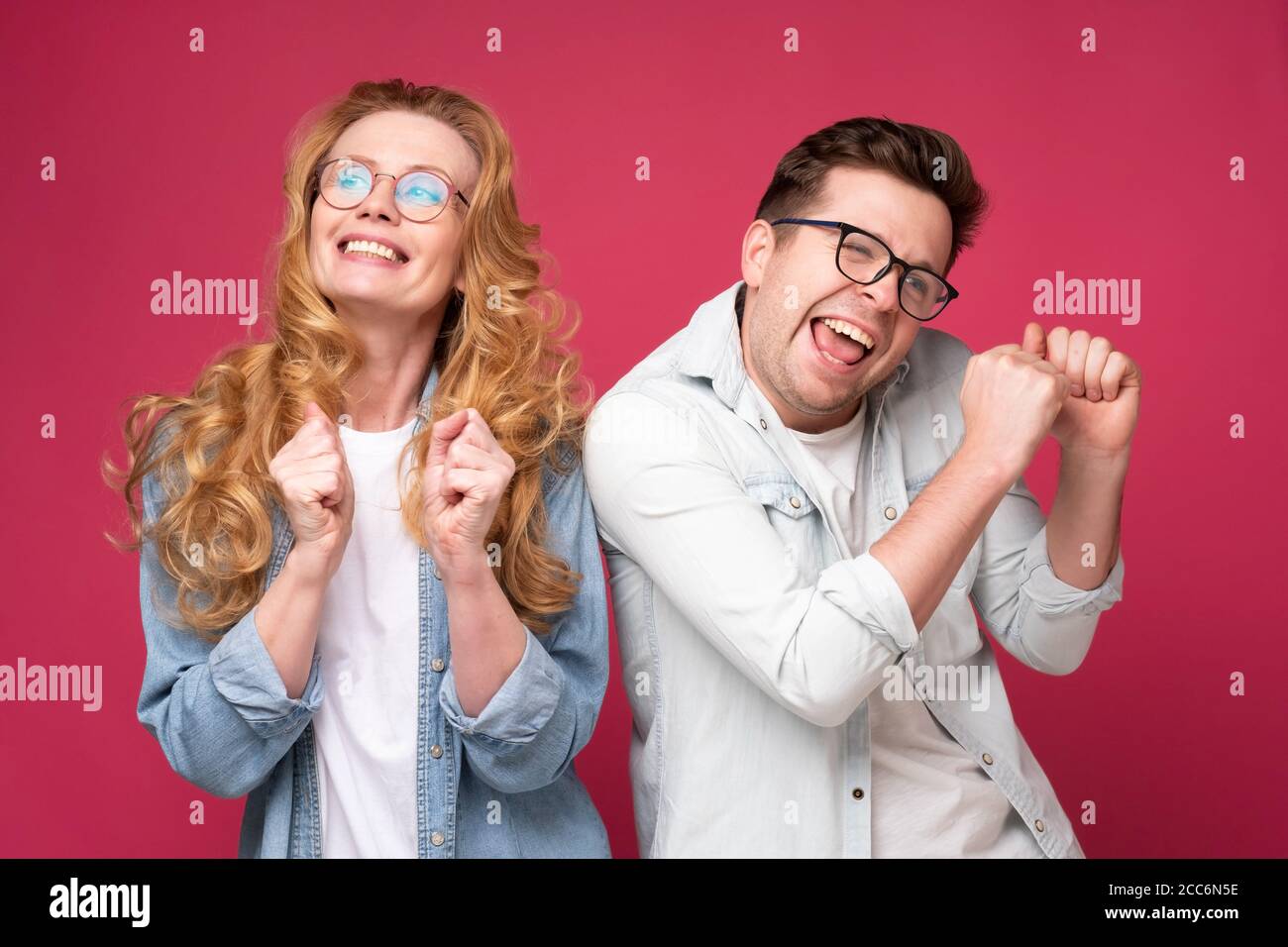 Dancing, moving, having fun. Young and happy man and woman celebrating ...