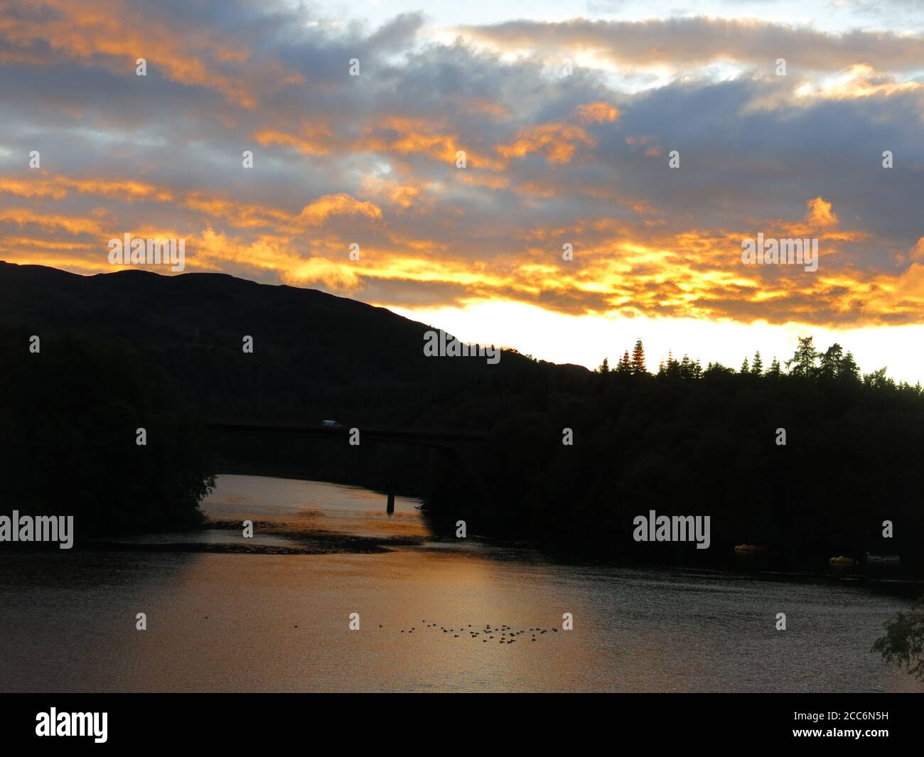 Scottish scenery: a sunset over Loch Faskally with the A9 road bridge ...