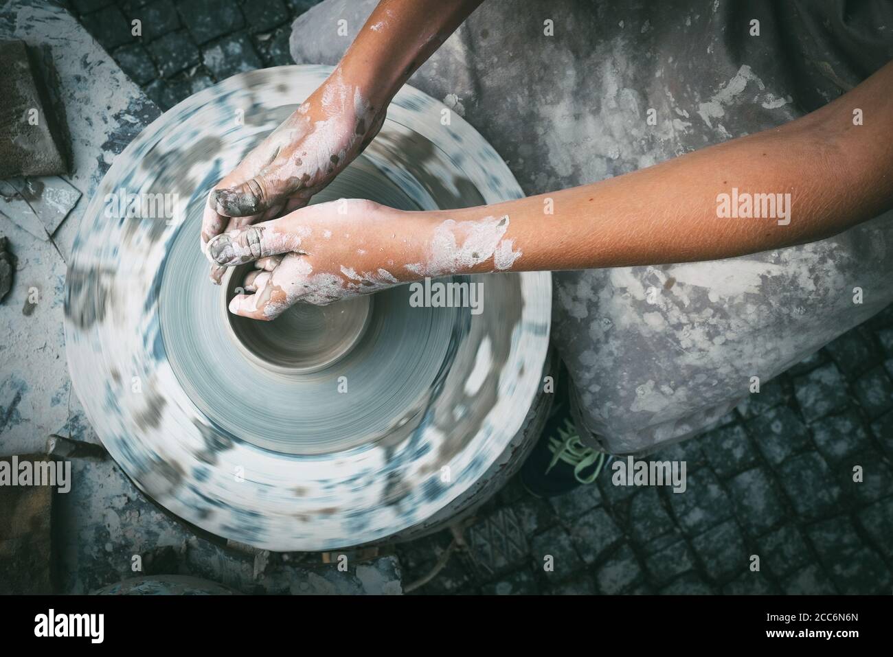 Child hands making pottery bowl. Top view vertical image Stock Photo ...