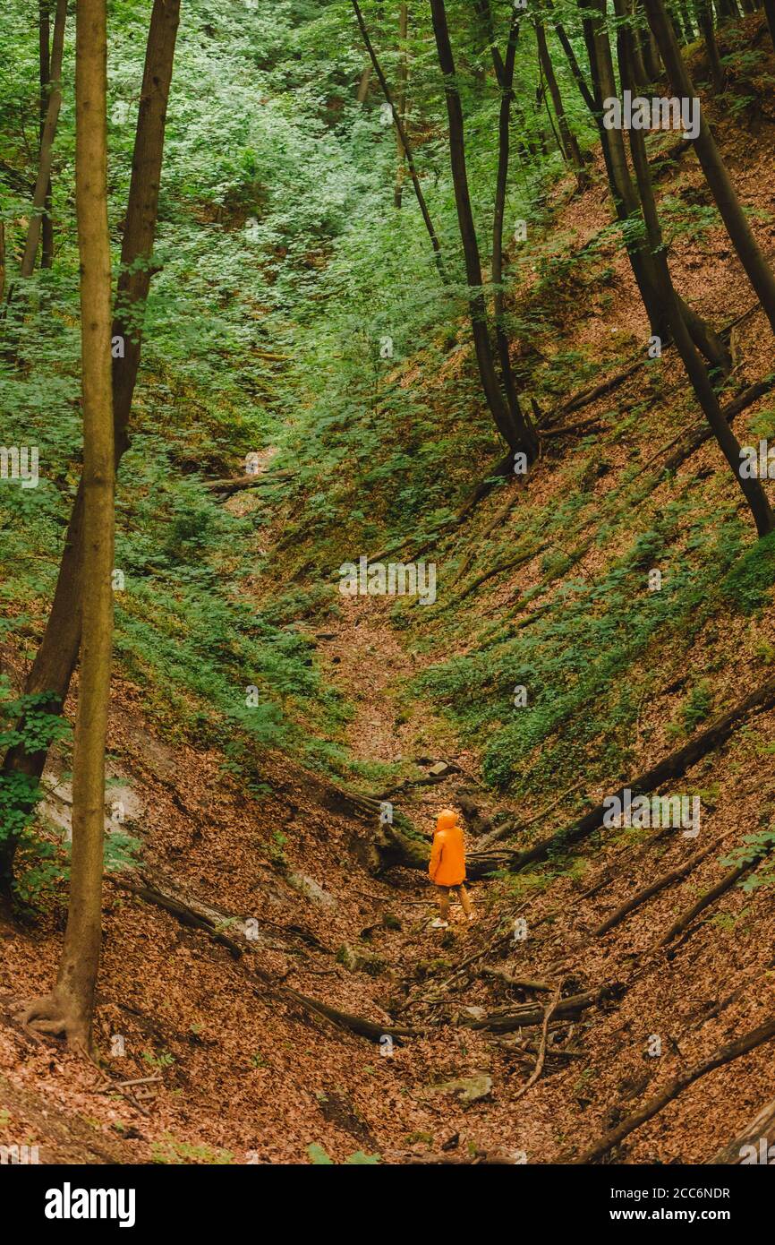 Man in yellow raincoat hood hi-res stock photography and images - Alamy