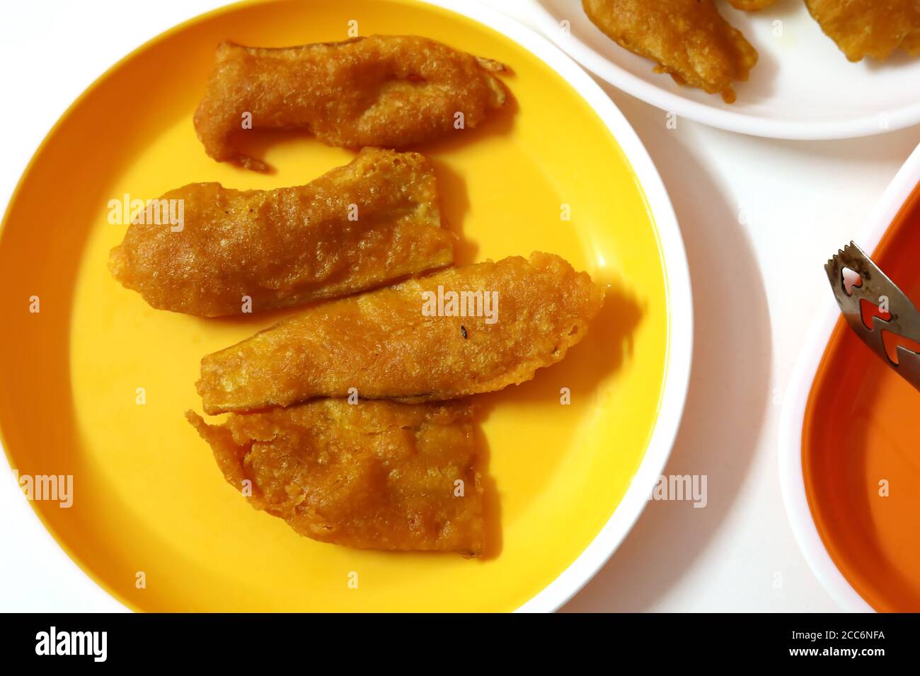 Indian food raw banana bajji or fritter, which is a traditional dish ...