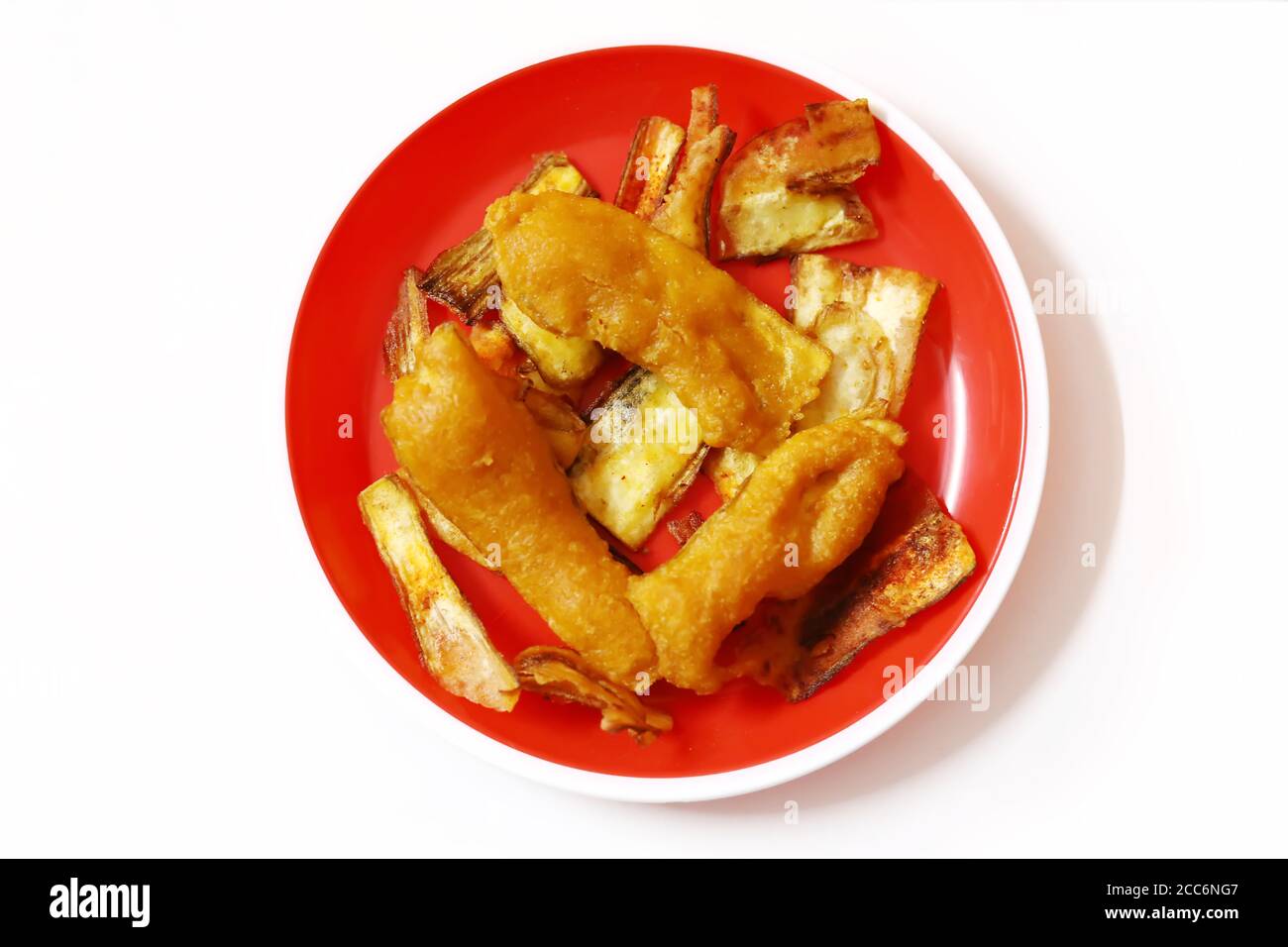 South Indian Potato Snack, Vazhakkai Bajji served in a red plate on ...