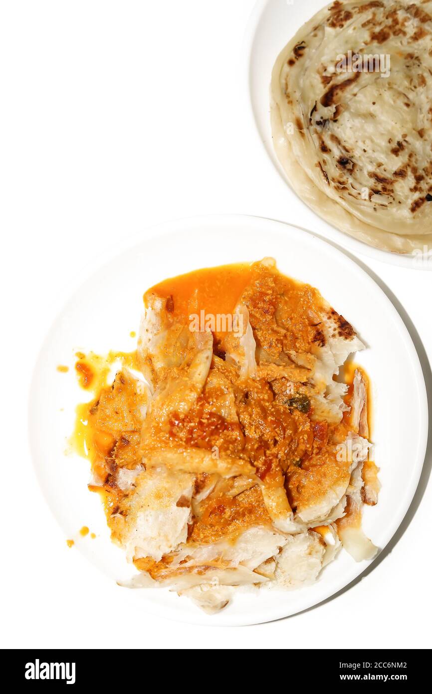 Homemade wheat paratha or layered parotta / flat bread served with ...