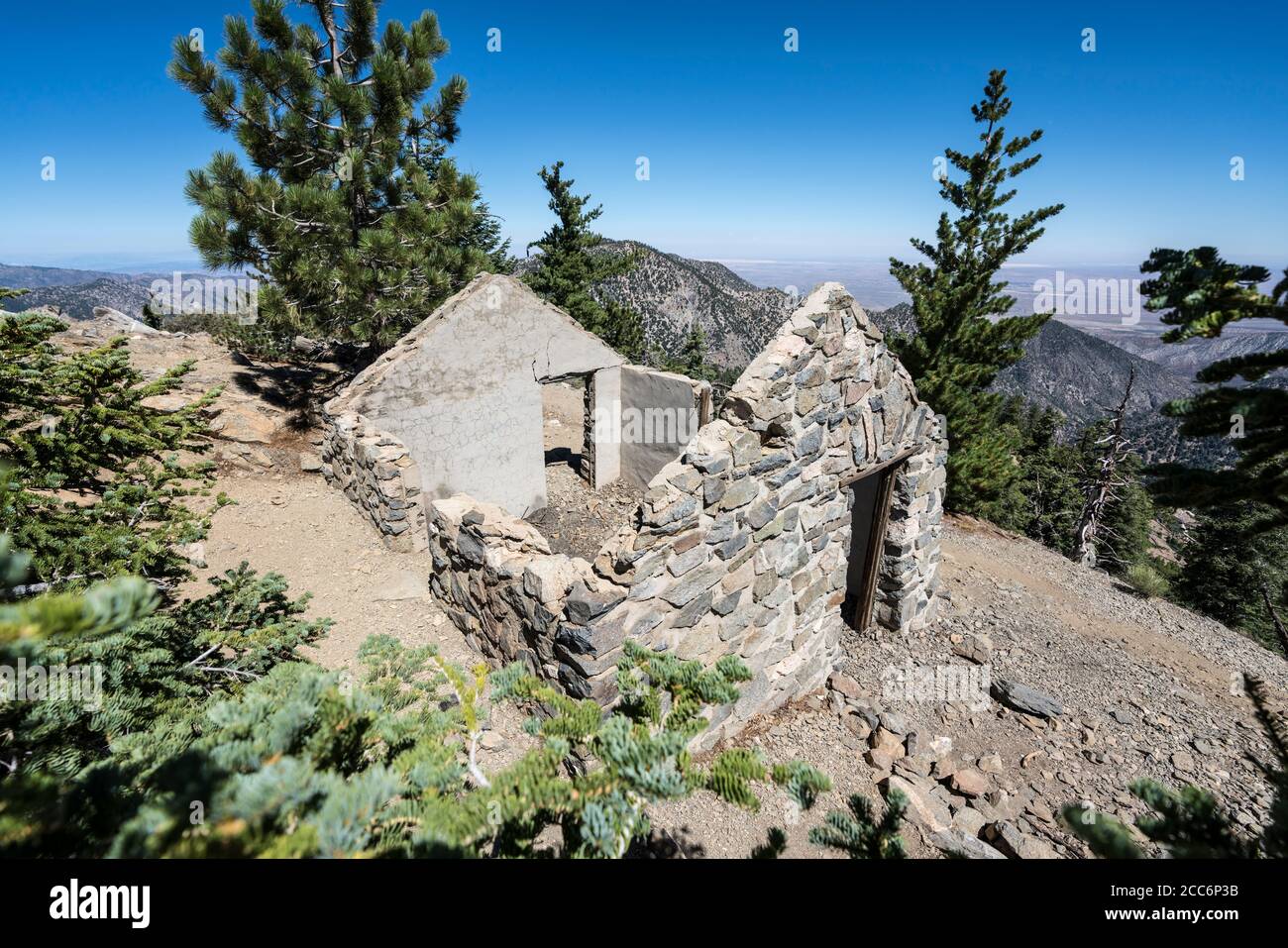 Stone cabin ruin and mojave desert view from Mt Islip peak in the San ...