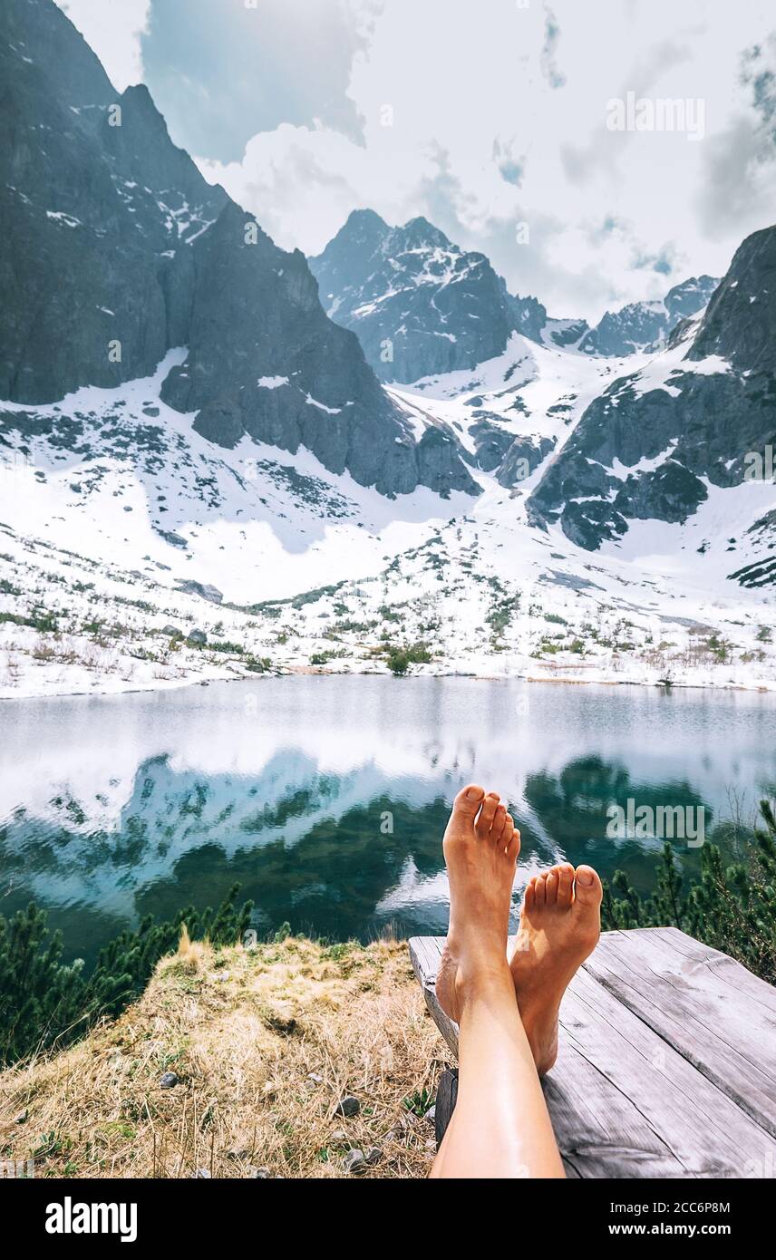 Woman traveler feet without shoes. Relax time after walk. Beautiful ...