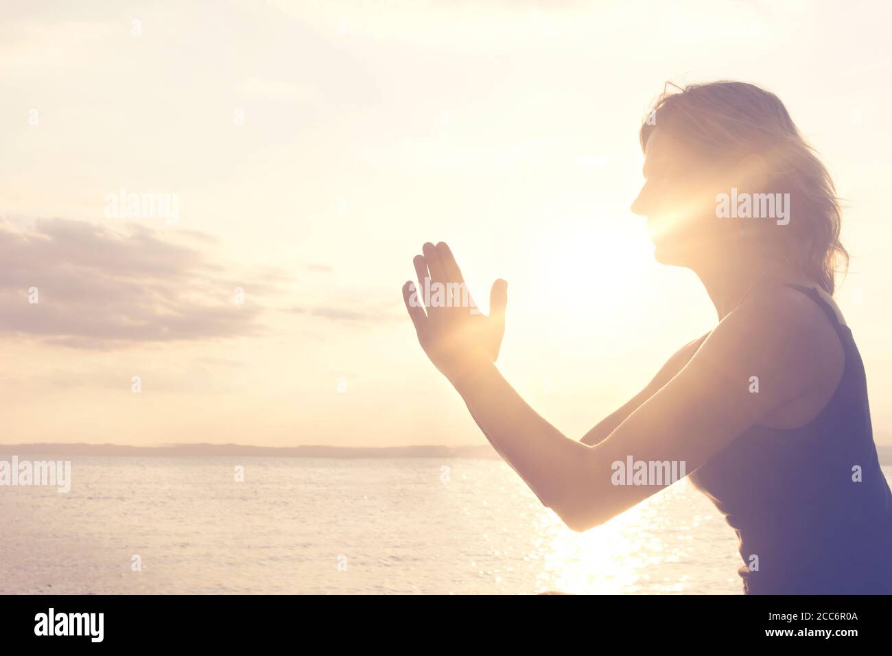 praying hands illuminated by the morning sun Stock Photo - Alamy