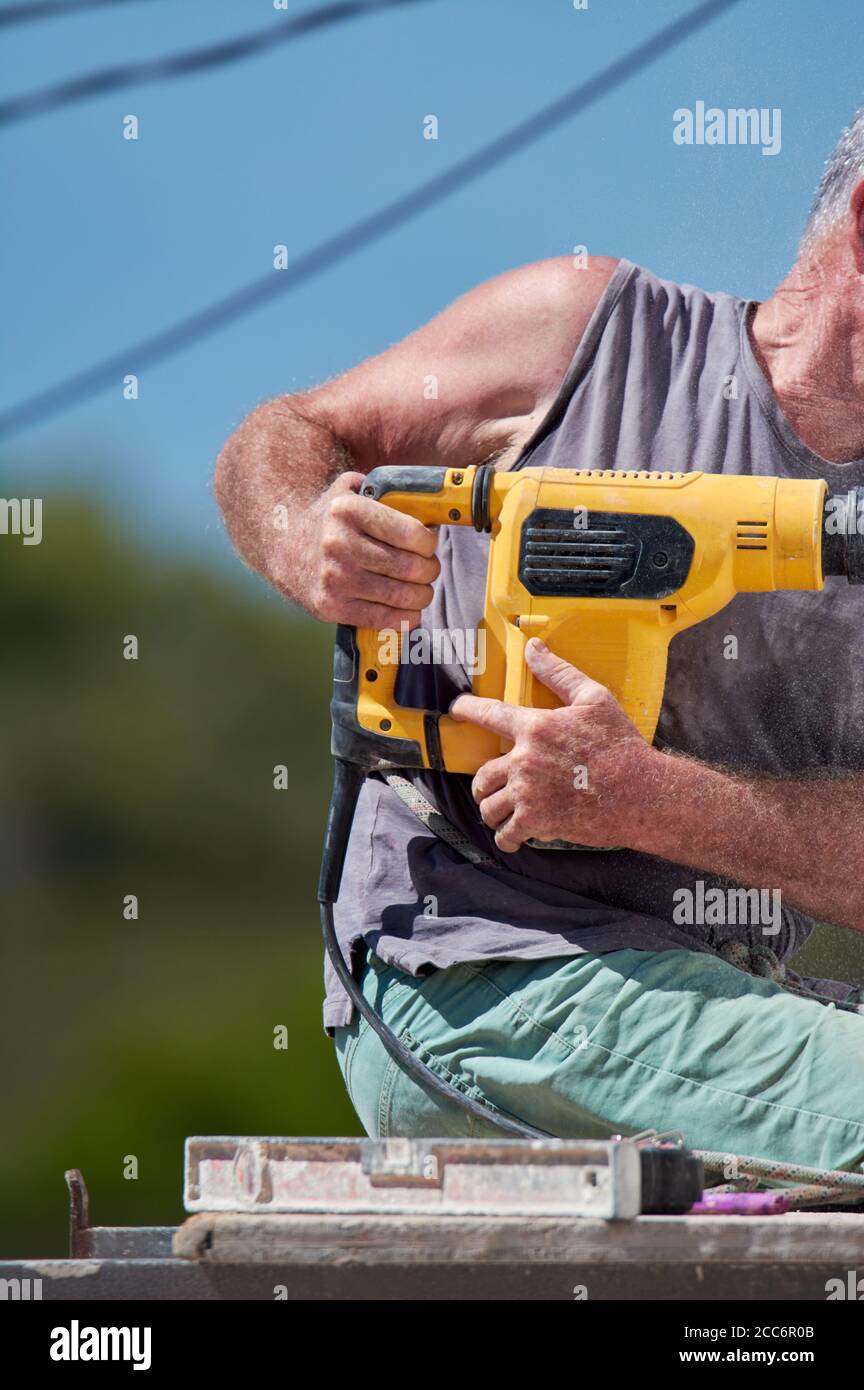 older man doing heavy work Stock Photo - Alamy
